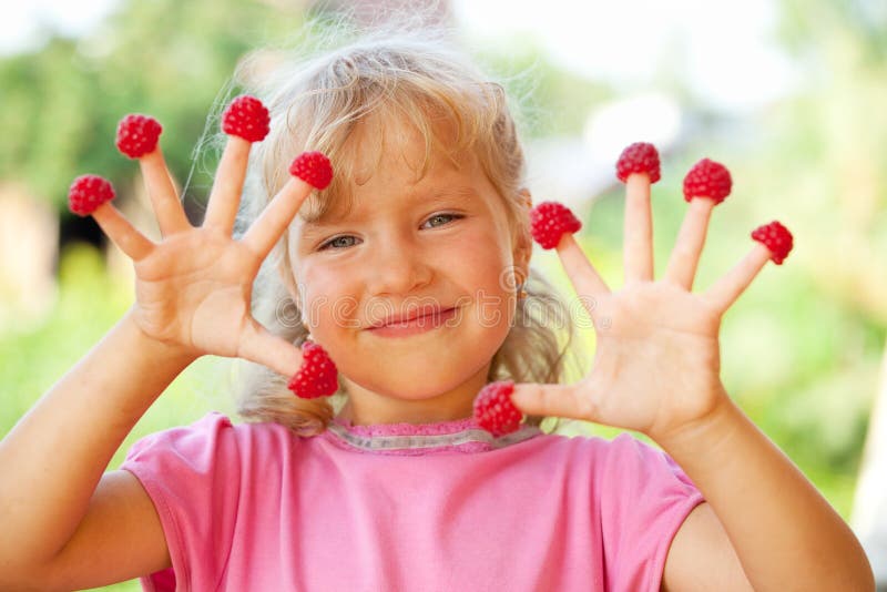 Little girl with raspberry stock photo. Image of preschooler - 20455620