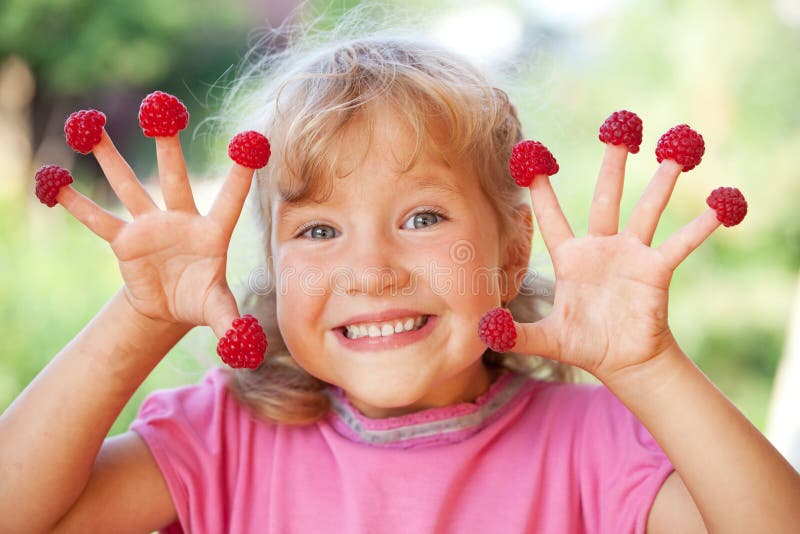 Little girl with raspberry stock photo. Image of nature - 24819566
