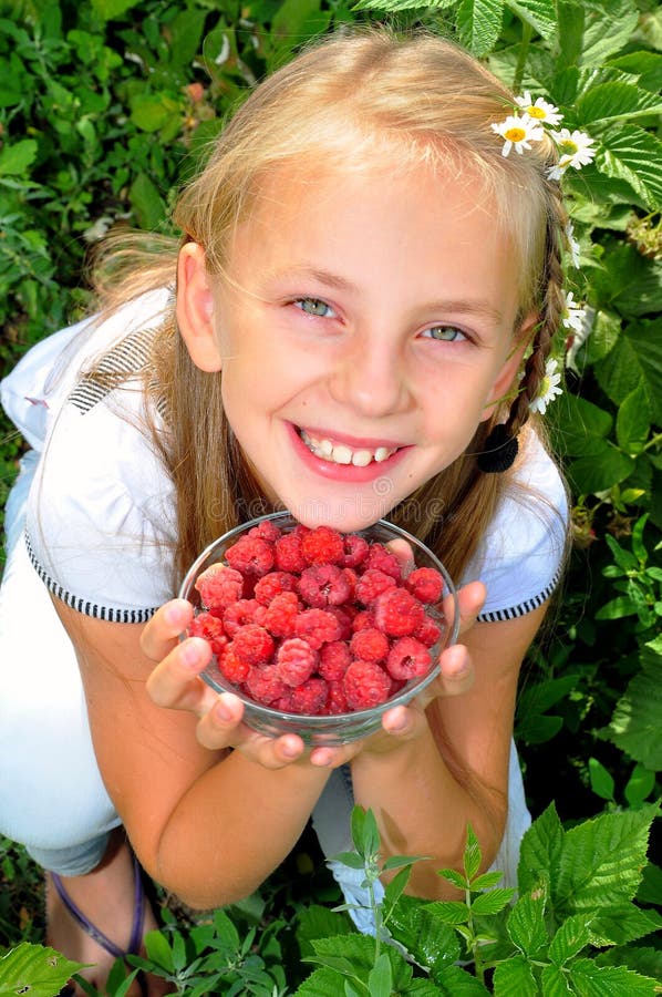 Little girl with raspberry stock image. Image of light - 25824357