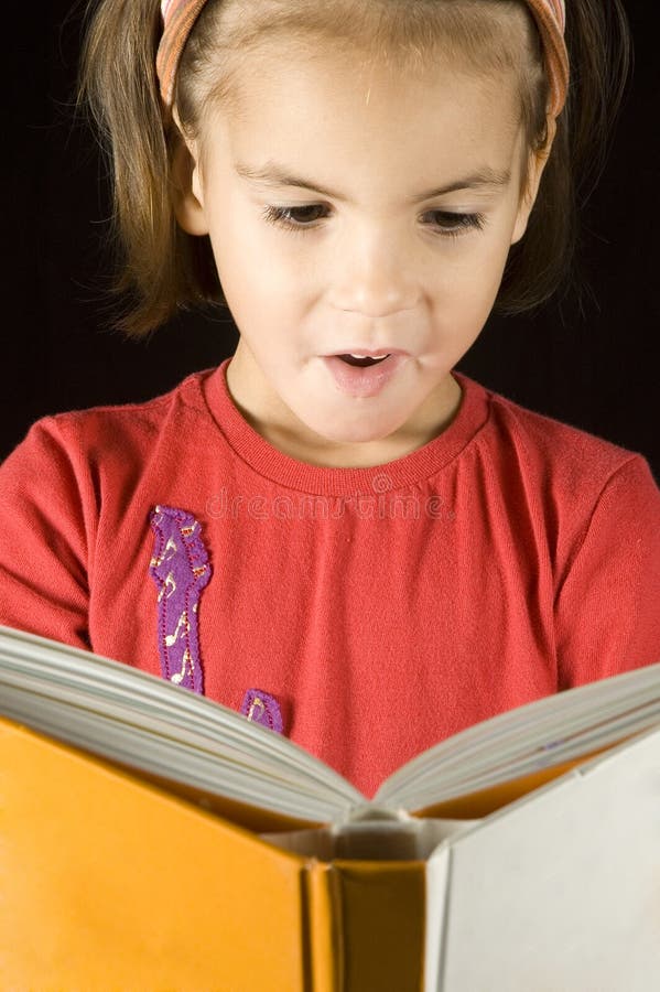Little girl reading a book stock image. Image of concept - 10411445