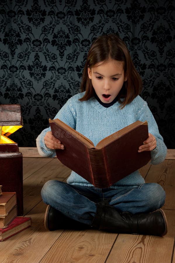 Little girl reading a book stock image. Image of adorable - 23168529