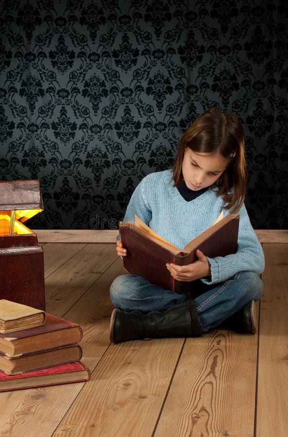 Little girl reading a book stock image. Image of black - 23277201