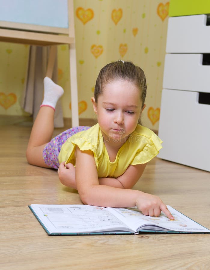 Little girl reading book stock photo. Image of beautiful - 27838436