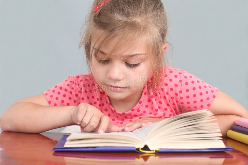 Little girl reading stock photo. Image of homework, book - 49854270