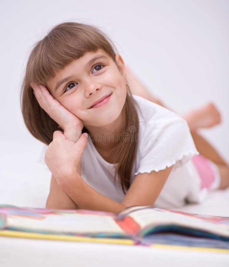 Girl is reading a book stock image. Image of girl, lesson - 48409041