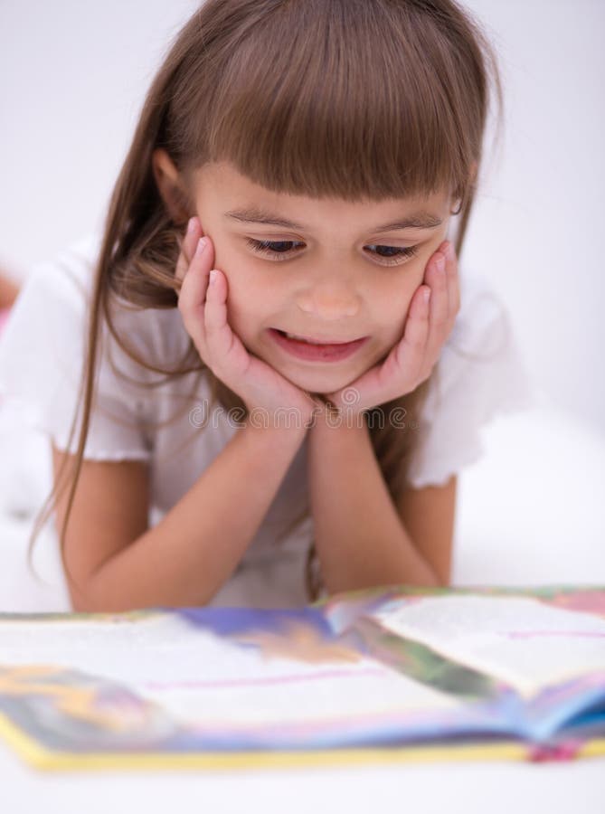 Little Girl is Reading a Book Stock Image - Image of reading, book ...