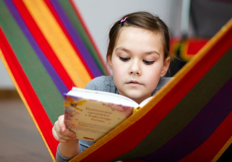Little Girl is Reading a Book Stock Image - Image of reading, book ...
