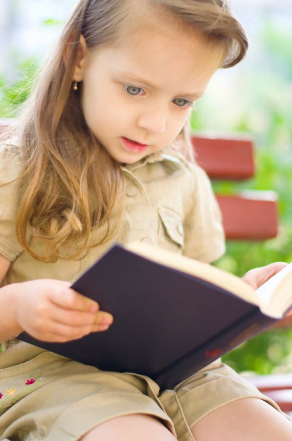 Little Girl is Reading a Book Stock Photo - Image of knowledge ...
