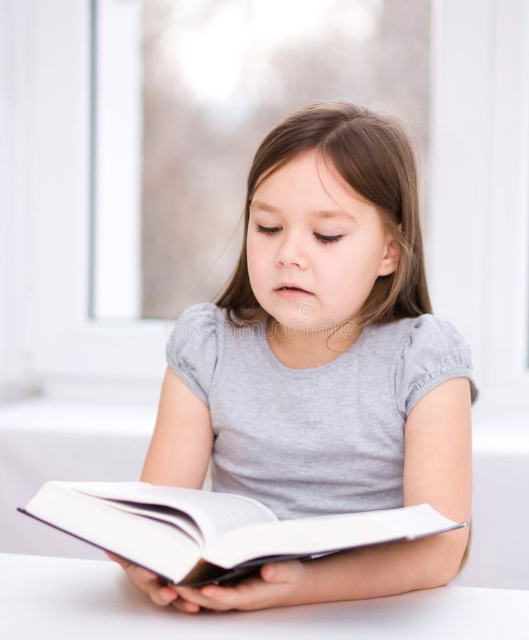 Little Girl is Reading a Book Stock Image - Image of brunette, indoors ...