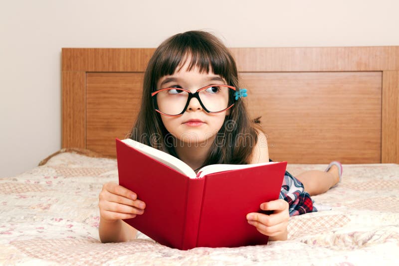 Girl Reading a Book at Home Stock Image - Image of learn, daughter ...