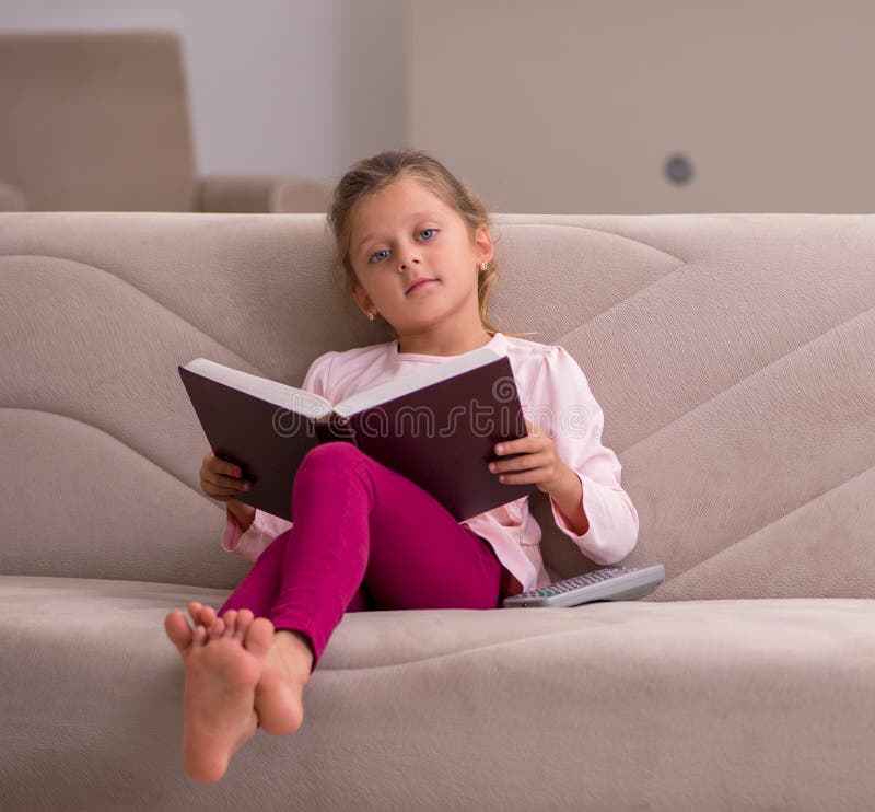Small Girl Reading Book at Home Stock Photo - Image of home, pupil ...