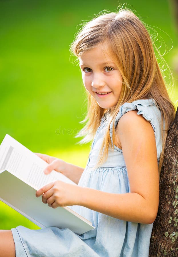 Little Girl Reading Outside