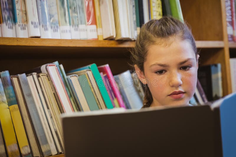 Little Girl Reading on Library Floor Stock Photo - Image of child, cute ...