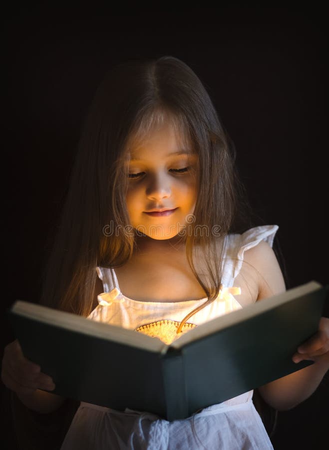Little Girl is Reading a Magic Book Stock Image - Image of literature ...