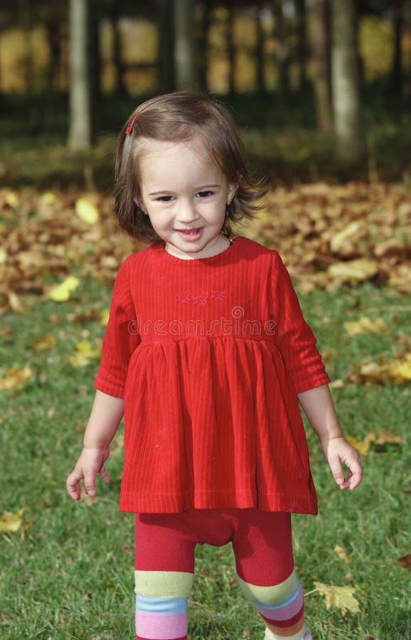 Little girl in red stock image. Image of happiness, girl - 11599757