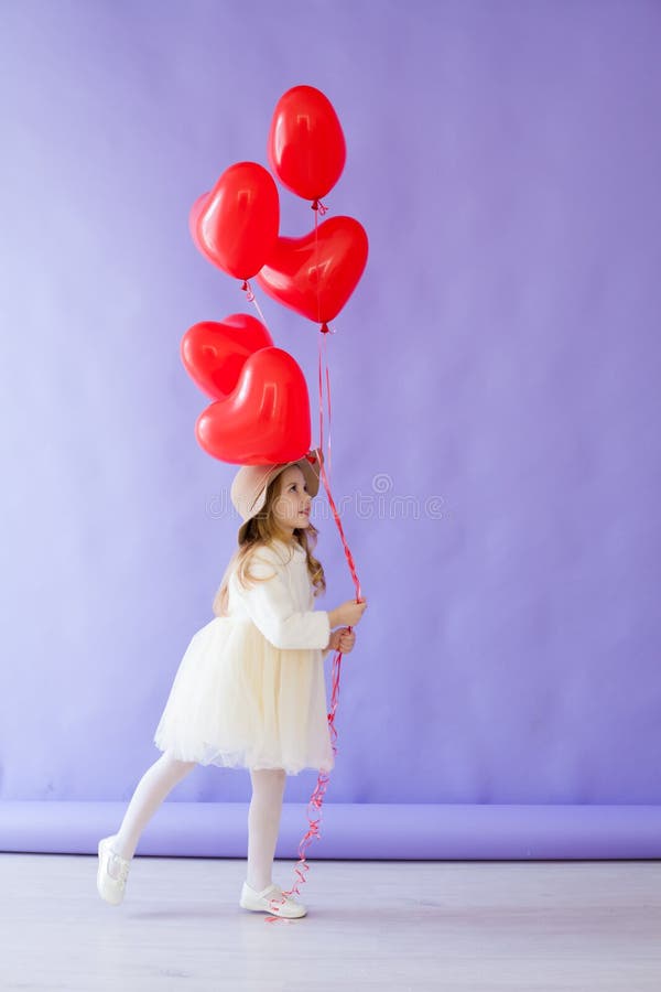 Little Girl with Red Air in the Shape of a Heart Stock Image - Image of ...