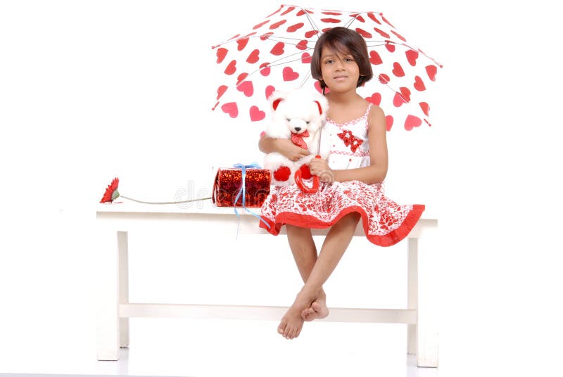 Little Girl with Red Objects Holding Teddy Bear Stock Image - Image of ...