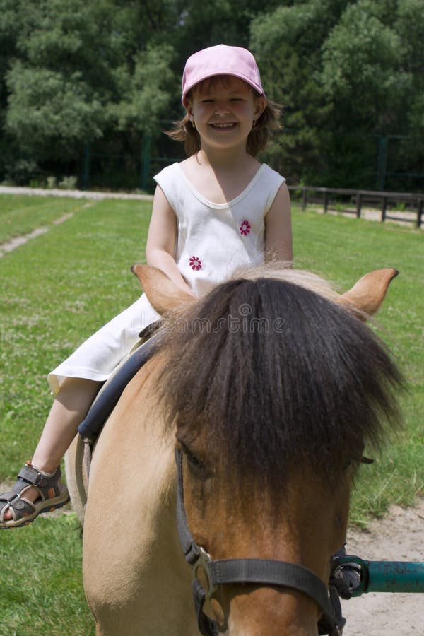 Little girl by ride stock photo. Image of ride, play, horse - 6445480