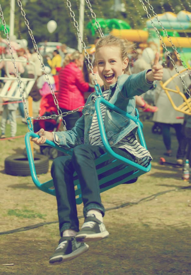 Little Girl is Riding a Carousel. Stock Photo - Image of park ...