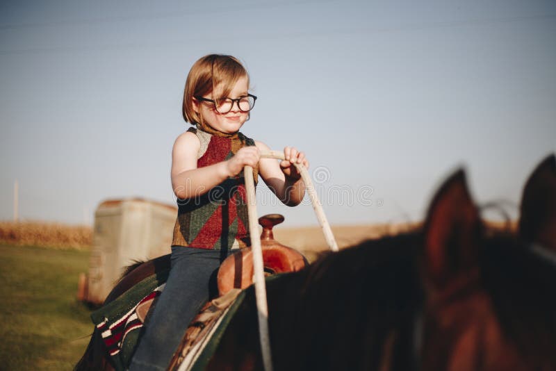 Little girl riding a horse stock photo. Image of western - 104747836
