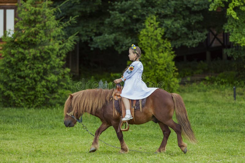 Girl riding a pony stock photo. Image of organic, happy - 287133518