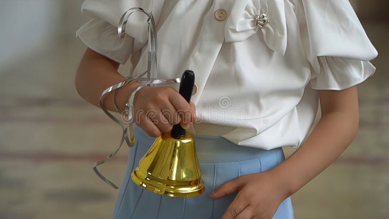 Little Girl Ringing a Bell in the School Classroom, Closeup Stock Photo ...