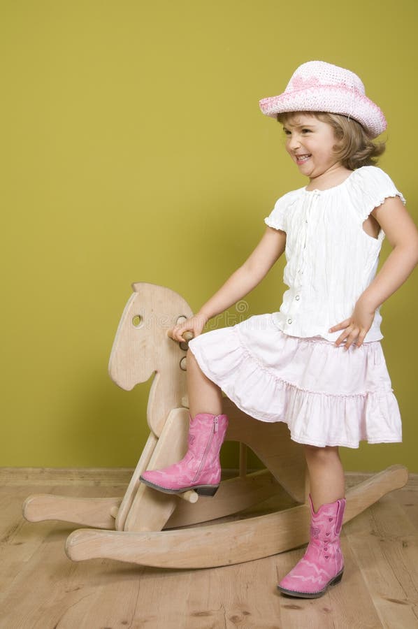 Little Girl and Rocking Horse Stock Photo - Image of play, childhood ...