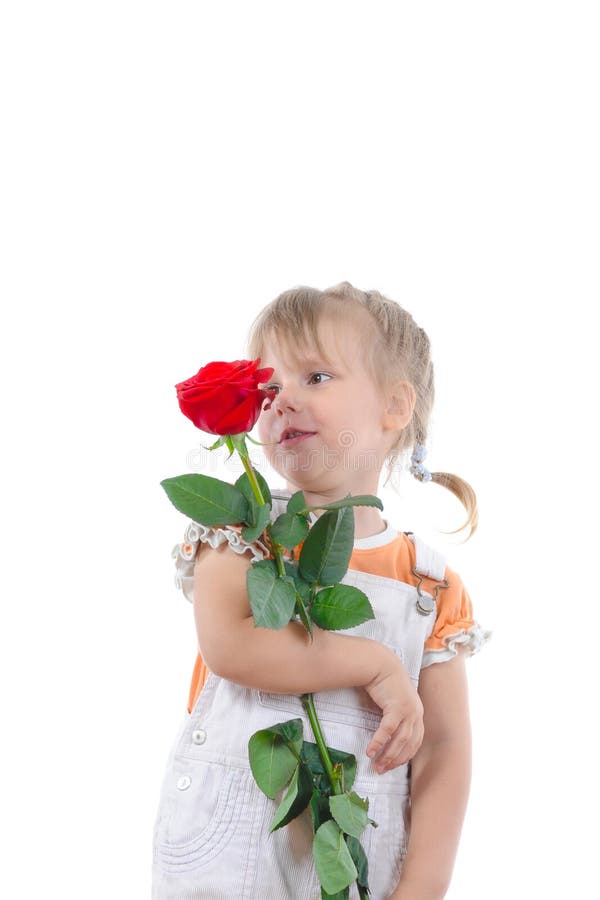 Little girl smelling rose stock photo. Image of childhood - 10409662