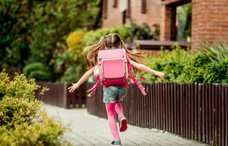 Little girl run to school stock image. Image of childhood - 280632653