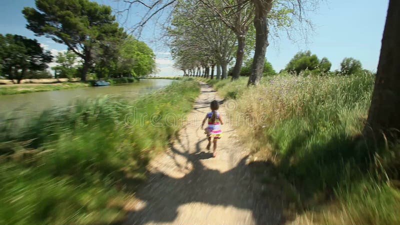 Little Girl Running Along Path Track in Nature Stock Video - Video of ...