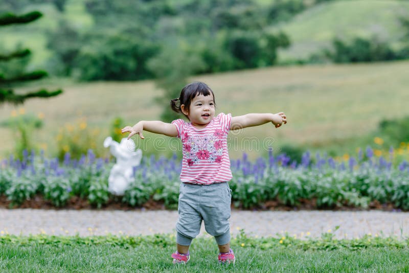 The Little Girl Running for in the Garden. Stock Image - Image of ...