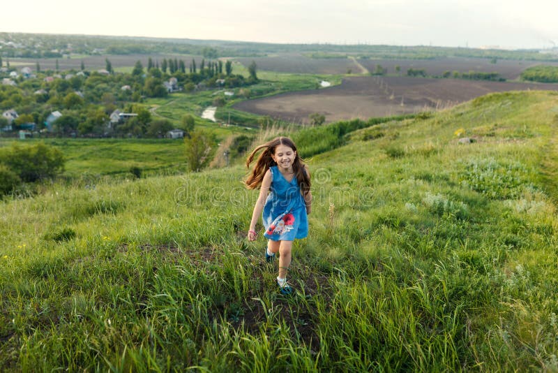 Little Girl Running on Meadow Stock Photo - Image of caucasian ...