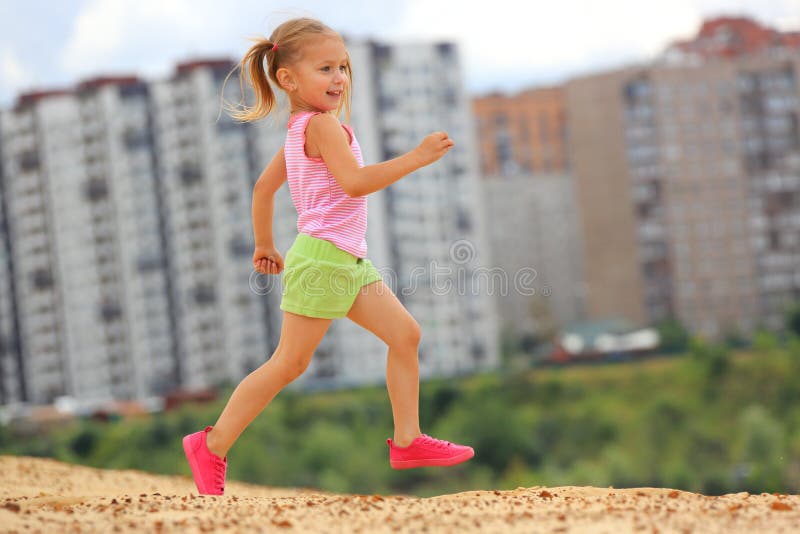 Girl running on sand stock photo. Image of teenage, energetically - 5869350