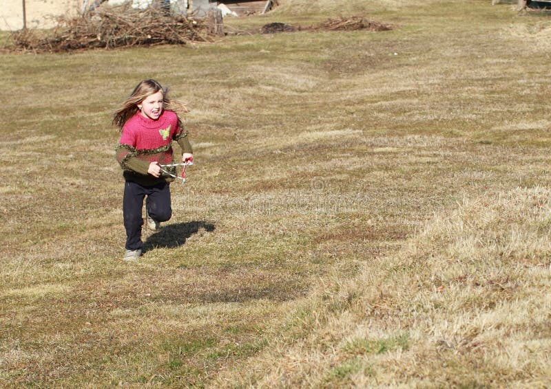 Little Girl Running with a Sling-shot Stock Image - Image of slingshot ...