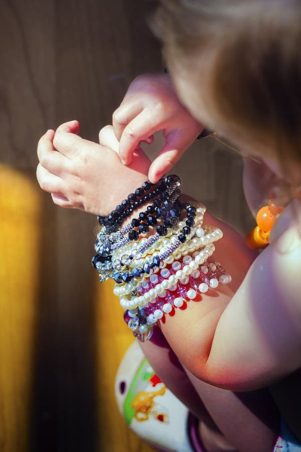 Little Girl S Hands with Bracelets Stock Photo - Image of decoration ...