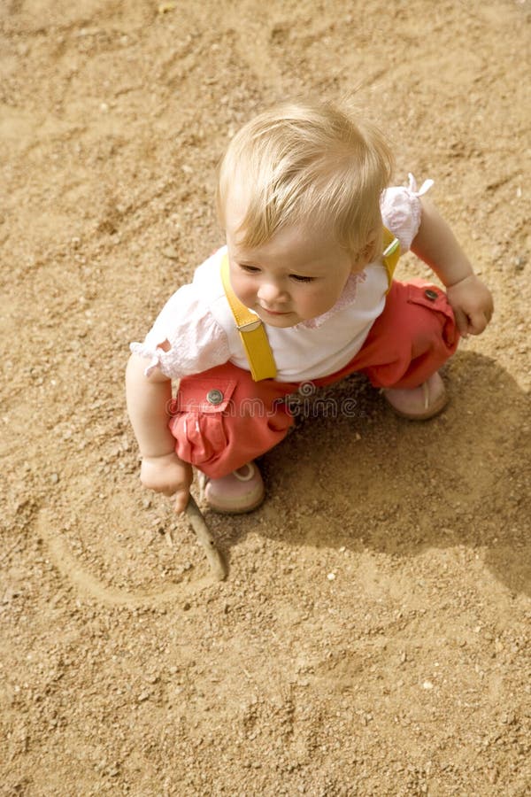 Little girl on a sand stock image. Image of preschool - 5510399