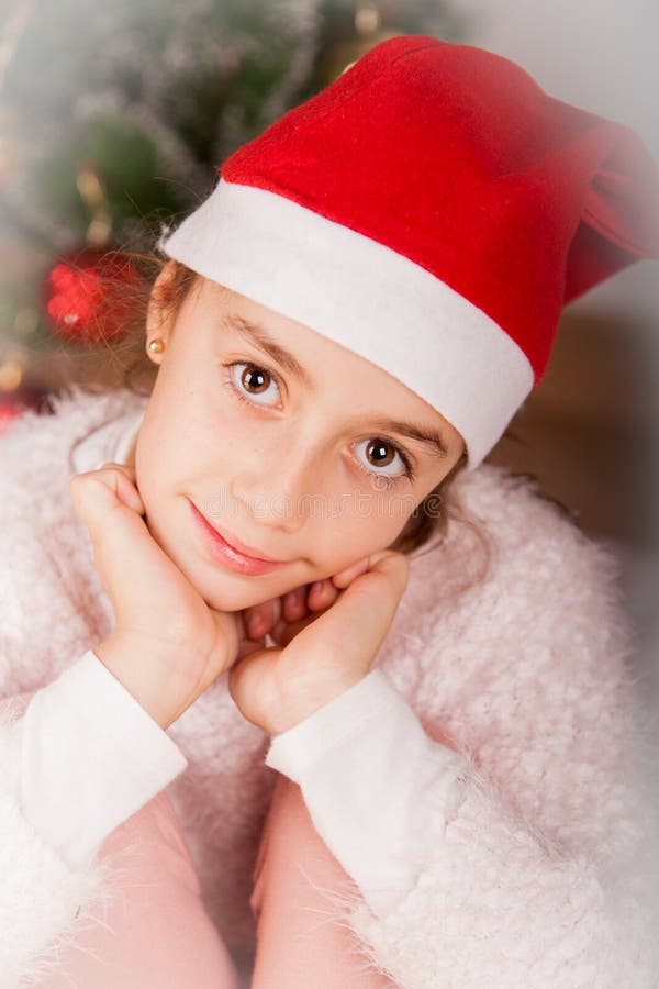 Little Girl with Santa Hat Smiling in Studio Stock Photo - Image of ...