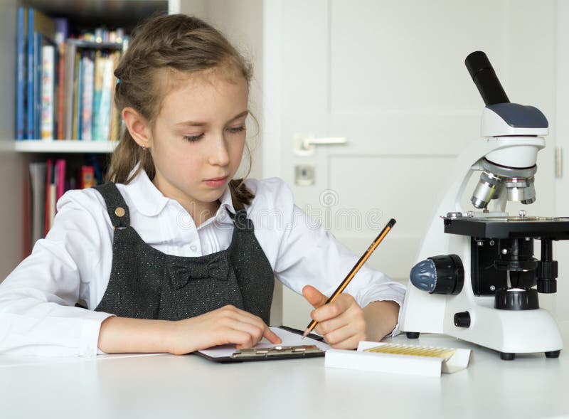 Little Girl in Science Class. Stock Photo - Image of pencil, desk ...