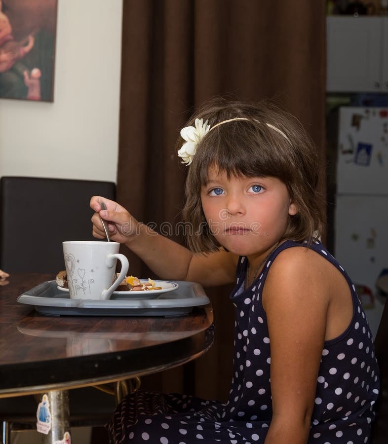 Little Girl Seating Behind the Table Stock Image - Image of concept ...