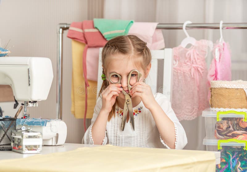 Little Girl in a Sewing Workshop Stock Photo - Image of sempstress ...
