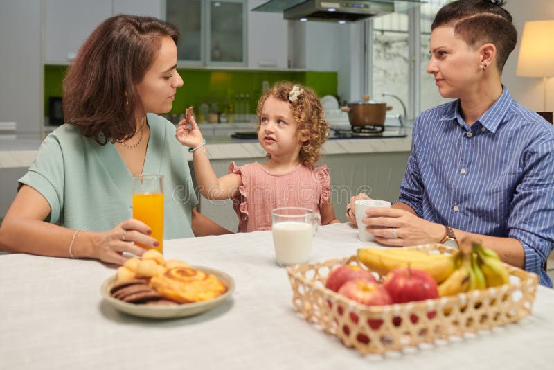 Girl Sharing Cookie with Mother Stock Image - Image of daughter, girl ...