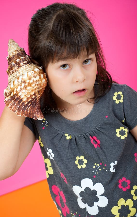Little girl with a shell stock image. Image of caucasian - 10688447