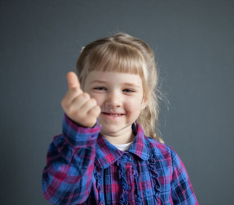 Little Girl Showing Thumd Up Stock Photo - Image of funny, little: 55680966