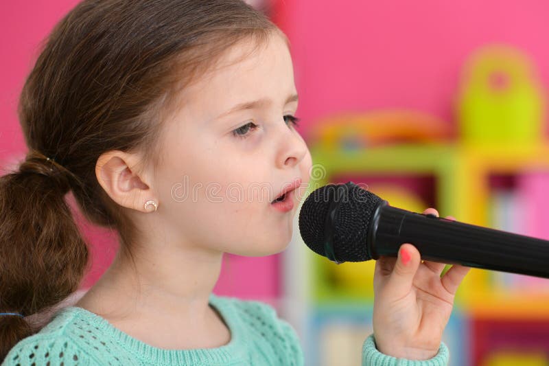 Little Girl Singing with Microphone Stock Image - Image of intelligence ...