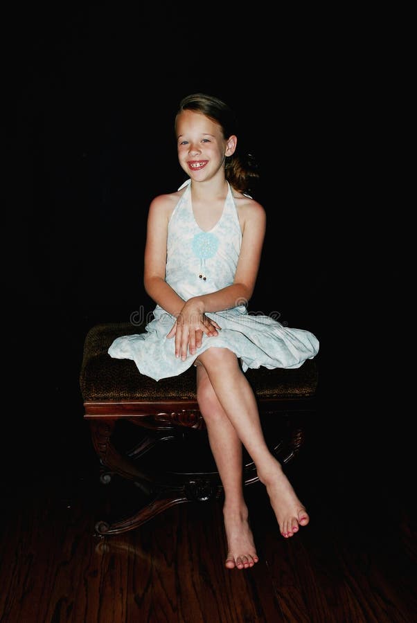 Little Girl Sitting On A Bench Picture. Image: 2834798