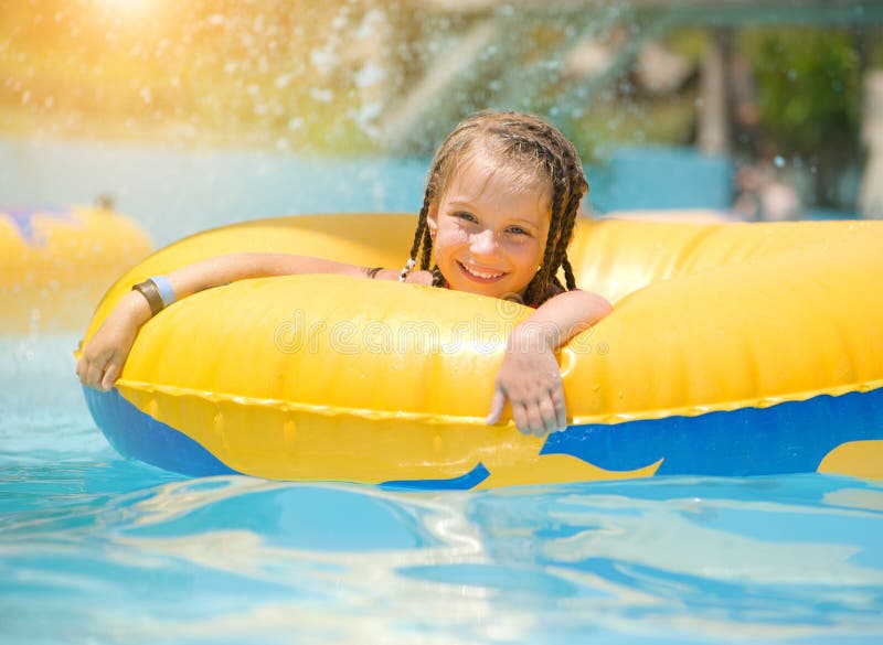 Little Girl Sitting on Inflatable Ring Stock Photo - Image of floating ...