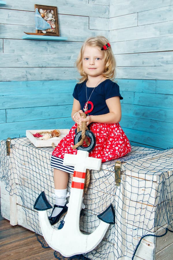 Little Girl Sitting and Keep Anchor Stock Image - Image of marine ...