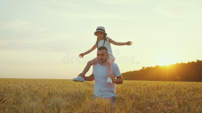 Girl Sitting on Shoulders of Father Walking in Field Stock Footage ... Girl Sitting on Shoulders of Father Walking in Field Stock Footage ...