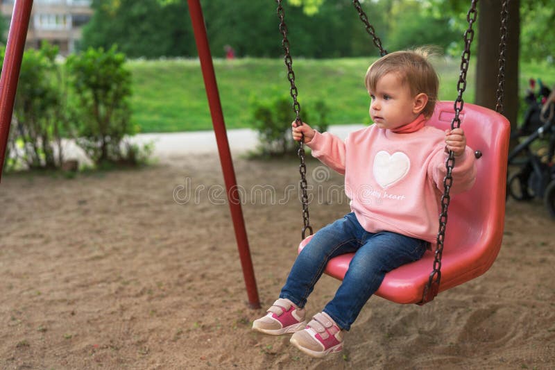 Little Girl Sitting on a Swing Stock Photo - Image of active, leisure ...