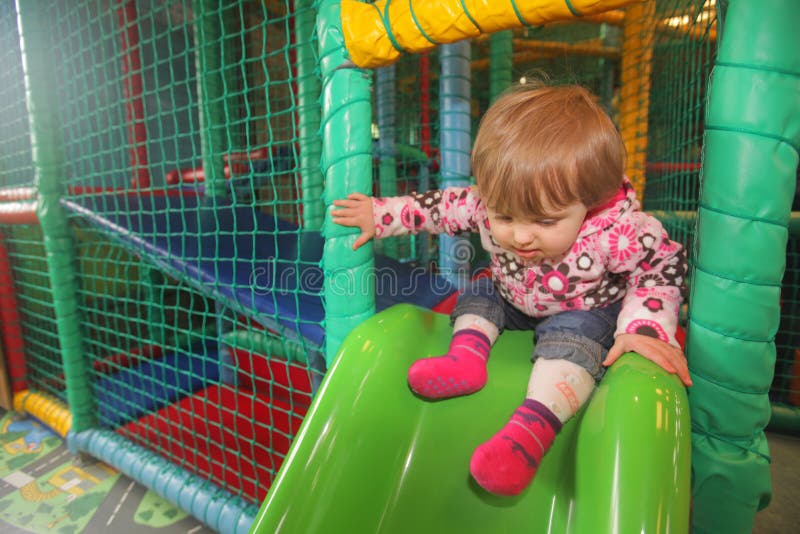 Little girl on a slide stock image. Image of emotion - 31811235